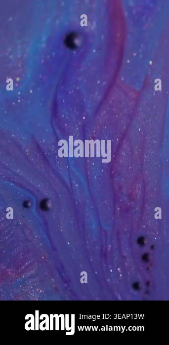 Vertical video. Paint spill. Bubble fluid. Defocused blue purple color ...
