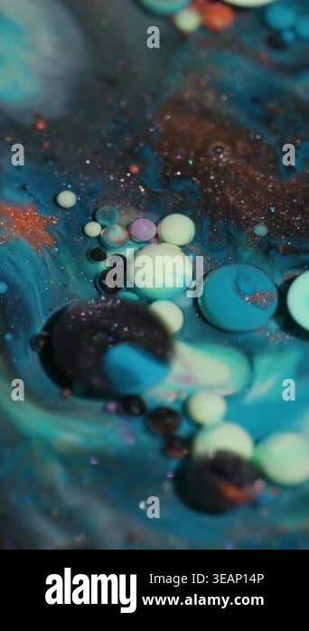 Vertical video. Oil background. Paint bubbles. Defocused orange blue ...