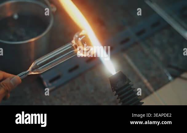 Watch the mesmerizing glassblowing process as flames skillfully shape ...