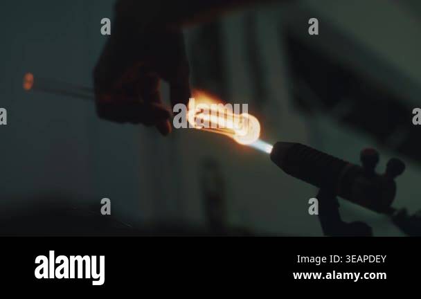 Watch the mesmerizing glassblowing process as flames skillfully shape ...