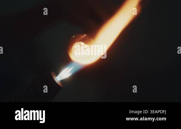 Watch the mesmerizing glassblowing process as flames skillfully shape ...