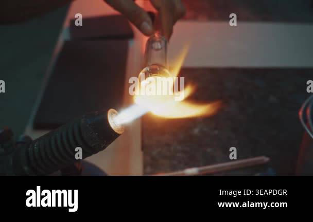 Watch the mesmerizing glassblowing process as flames skillfully shape ...