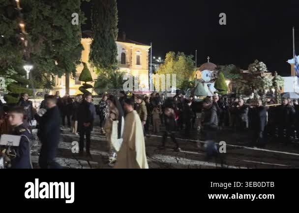 Xanthi, Greece - April 10 2026: Crowd gathers as participants carry a ...