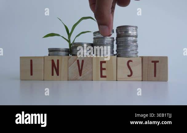 The investment concept uses blocks with the words INVEST written on ...
