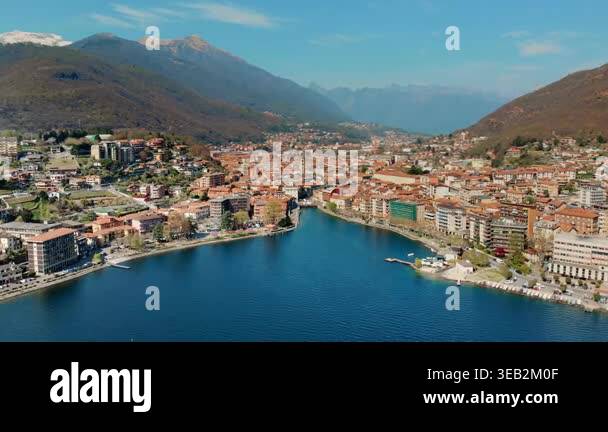 Elevated drone perspective over Italian resort town on lake shore. Wide ...