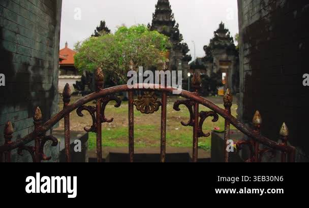 Balinese temple entrance with stone gate and ceremonial courtyard in ...