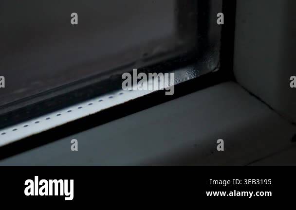 Close-up view of modern window frame and glass corner indoors. Minimal ...