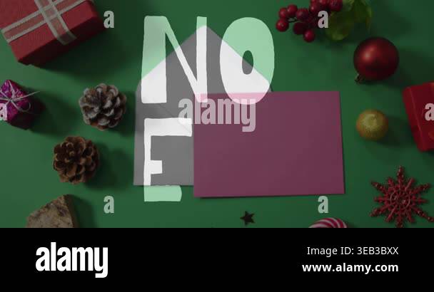 Animation of christmas greetings text over christmas decorations ...