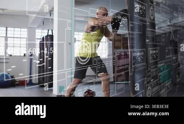 In gym, man practicing boxing with animation overlaying his movements ...