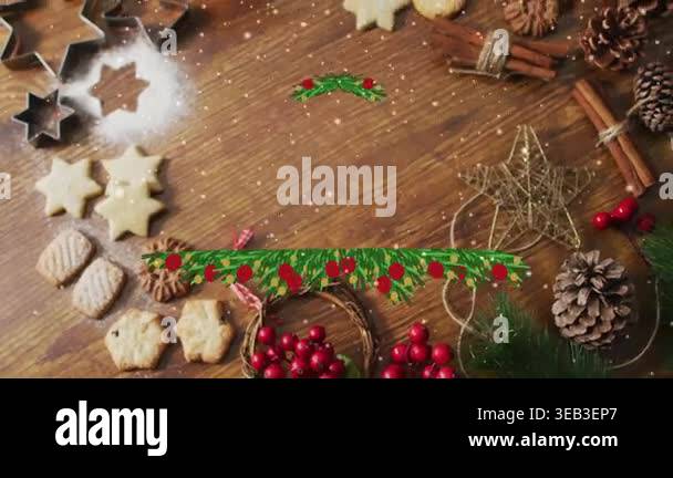 Animation of snow falling over christmas cookies and decorations on ...
