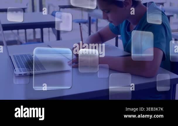 Multiple square shapes floating over caucasian boy studying in the ...