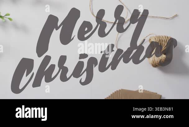 Animation of christmas greetings text over christmas decorations ...