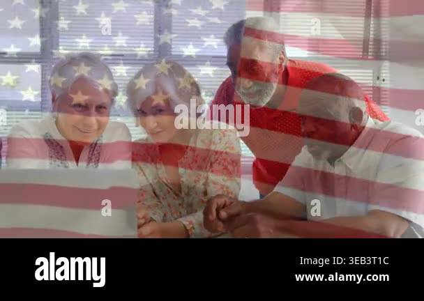 Animation of flag of usa over senior diverse people using laptop ...