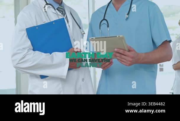 Animation of earth day text over caucasian doctors using tablet. Global ...