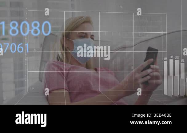 Masked woman tapping smartphone in living room and activating floating ...