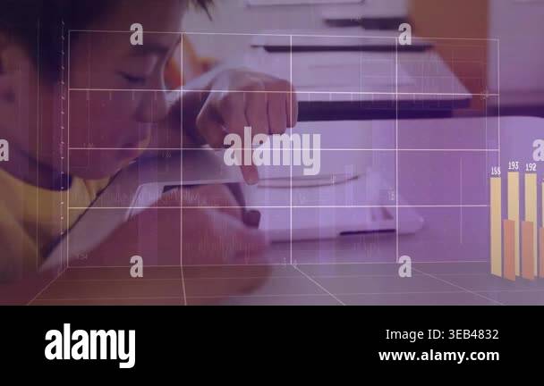 Student studying data by tapping tablet in classroom generating ...