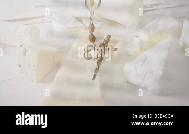 Wooden beads and key placed on dictionary text with cheese slices ...