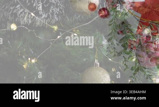 Animation of christmas greetings text over christmas tree and ...