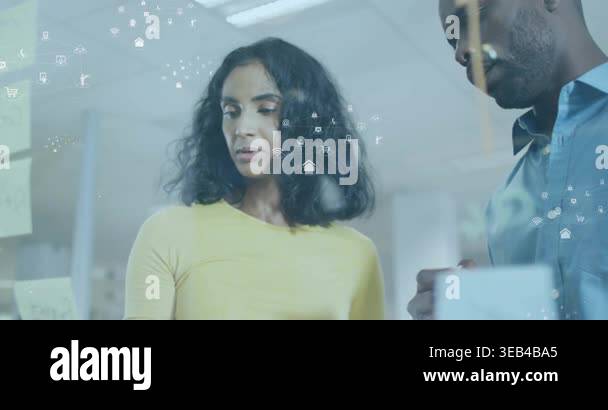 Animation of digital icons floating over diverse man and woman ...