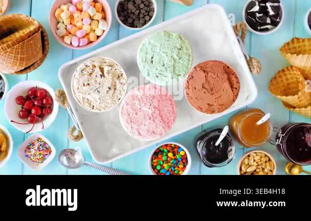 Summer ice cream buffet with a variety of flavors and sweet toppings ...