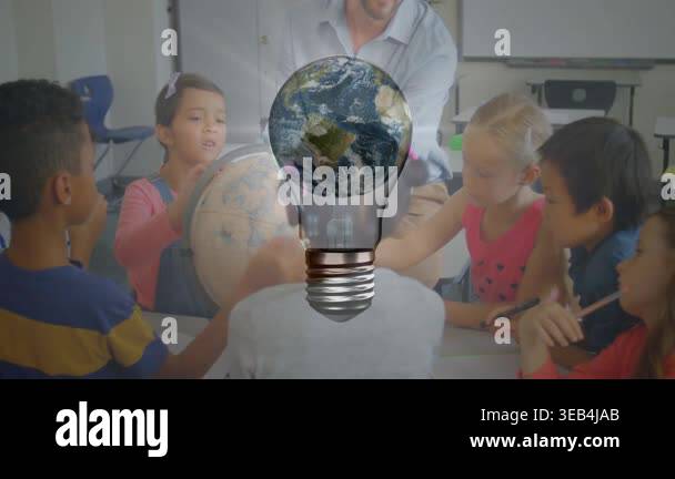 Teacher leaning, class holding globe, globe motion sparking bulb Earth ...