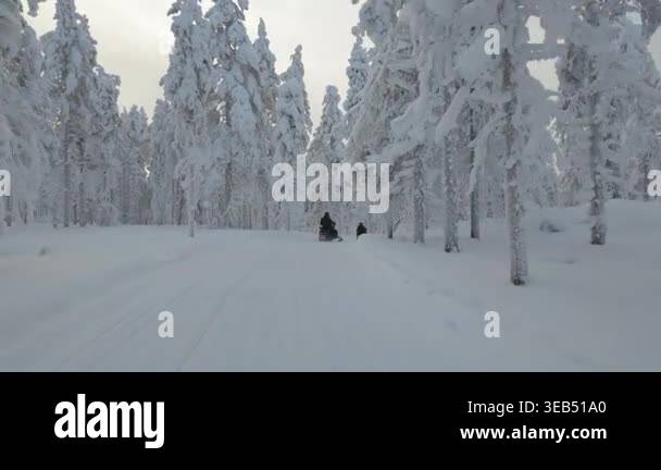 Experience an exhilarating journey on snowmobiles through the magical ...