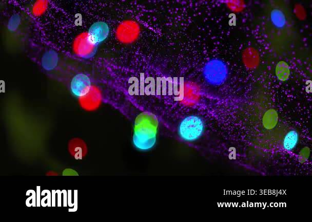 Animation of purple digital wave over glowing colorful spots of light ...