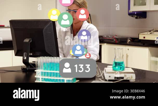Woman lab worker checking screen, user icons appearing, growing over ...