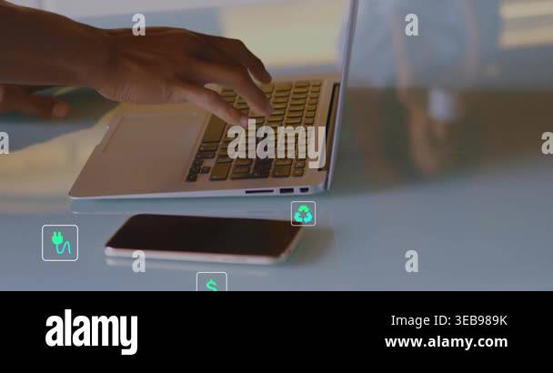 Male hand typing on laptop analyzing energy and finance while ...