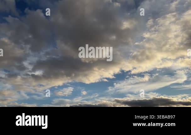 A mesmerizing timelapse of a sunset sky filled with swirling clouds ...