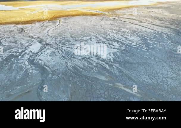 Aerial view capturing the dynamic movement of earthy textures in a ...
