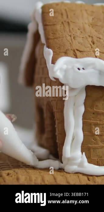 Mother Crafting Gingerbread House with Kids for Festive Holiday Joy ...