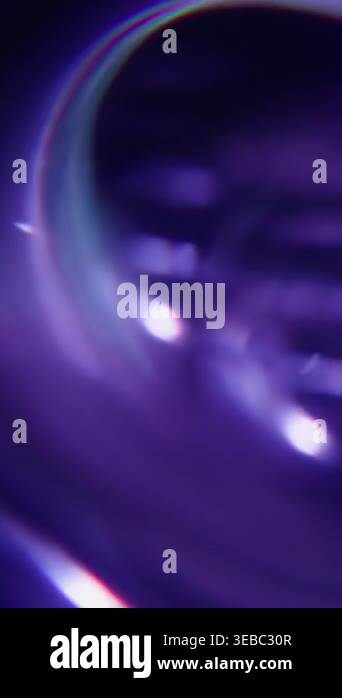 Vertical video. Blur dazzle swirl. Lens flare. Purple blue color ...
