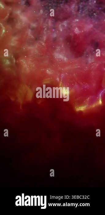 Vertical video. Smoke cloud. Ink background. Defocused pink green ...