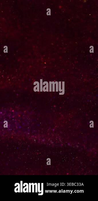 Vertical video. Bokeh glow. Glitter abstraction. Purple red color ...