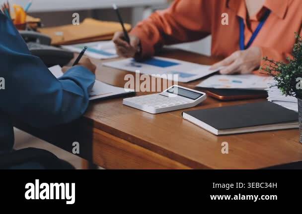 businesswoman in office with documents on table Stock Video Footage - Alamy