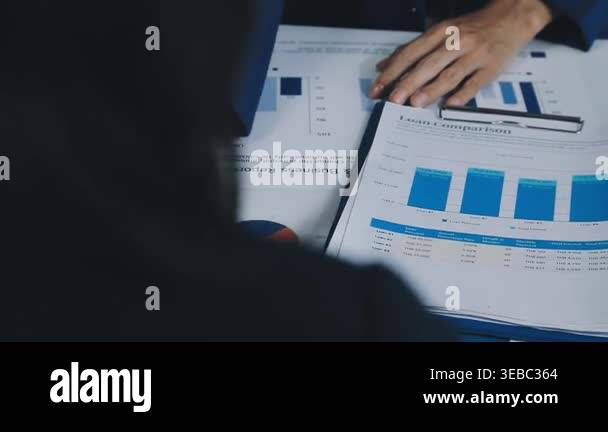 businessman and financial charts with business team in the office Stock ...