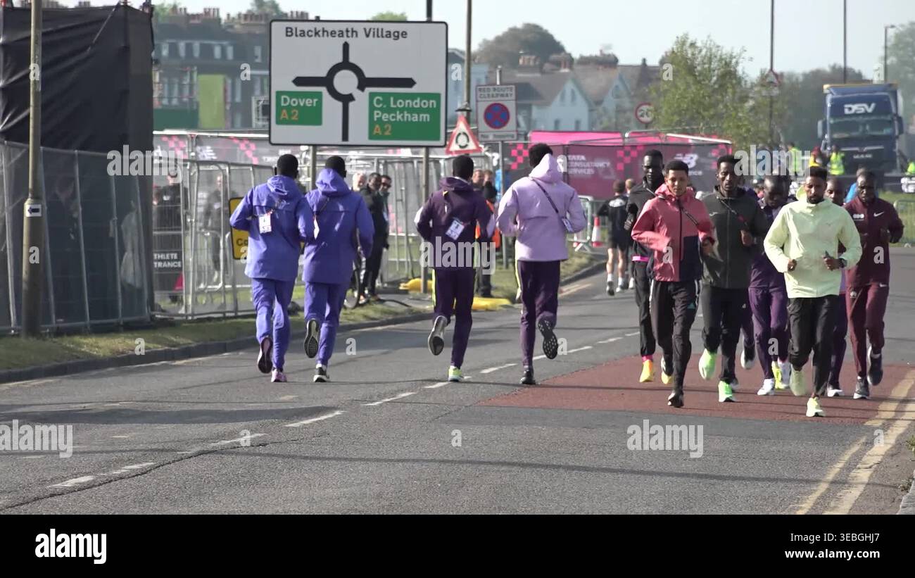 Crowds pour the streets in record-breaking London Marathon Stock Video ...