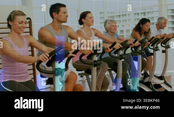 On class cue six riders pedaling on spin bikes in fitness class, HUD ...