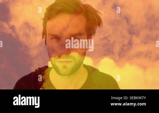 Man in close-up reacting to warm cloud overlay drifting, closing eyes ...
