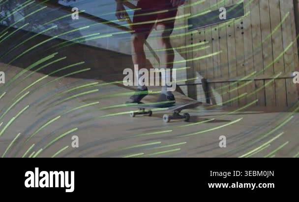 Skateboarder crouching at ramp and drawing green flow lines by ...