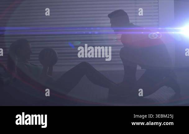 Animation of man and woman exercising together in gym, woman doing sit ...
