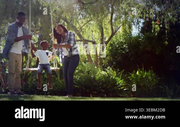 Animation of autumn leaves falling over happy african american family ...