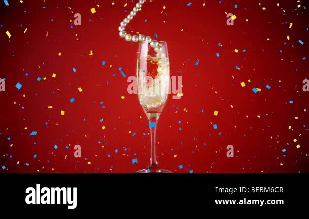 Confetti falling and beads necklace falling in champagne glass against ...