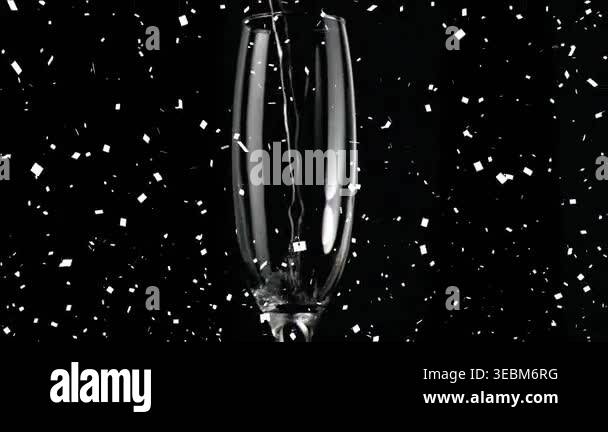 Animation of confetti over glass of champagne. Party, celebration and ...