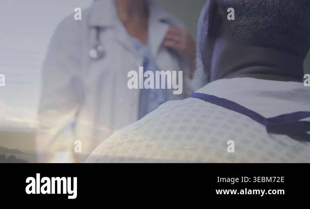 Consulting with patient, doctor in hospital room with sunlight ...