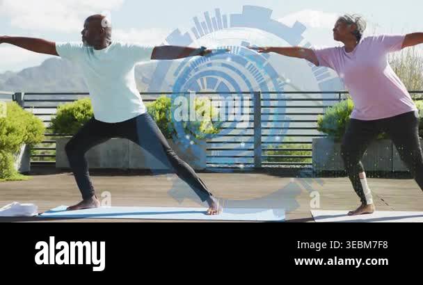Practicing yoga on rooftop, two people with digital health data ...