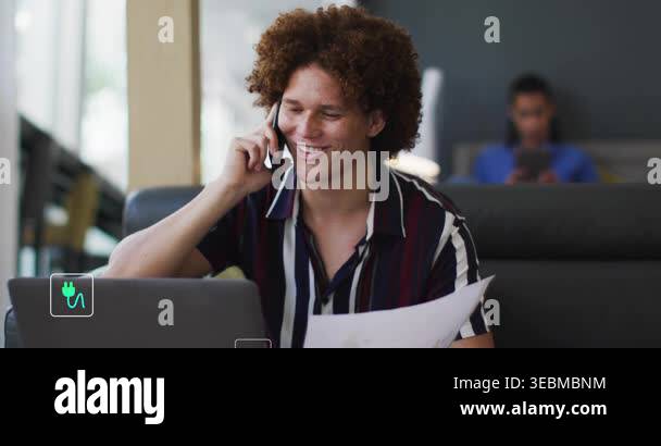 Freelancer taking phone call in cafe, reviewing sustainability paper on ...