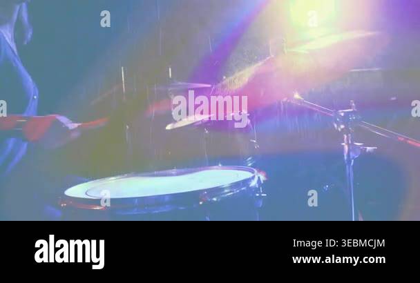 Woman stepping behind snare drum and striking beats on music stage kit ...