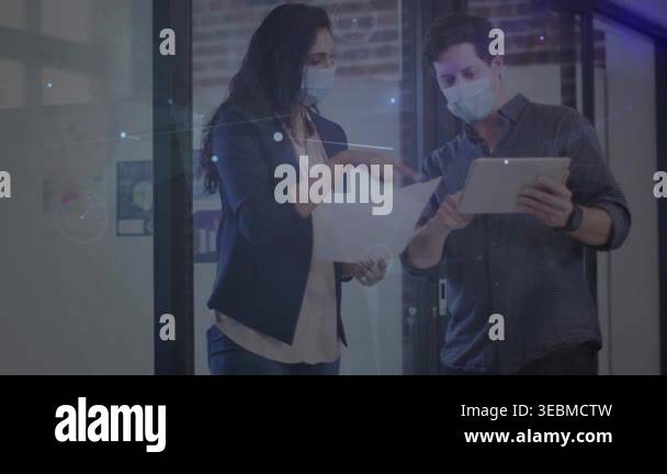 Animation of glowing network over male and female colleague in face ...